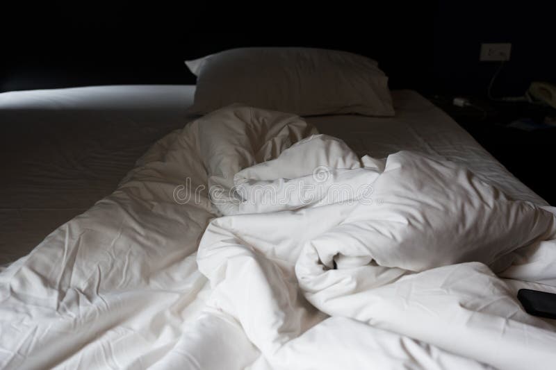Rumpled bed in the hotel stock photo. Image of fluffy - 343616150