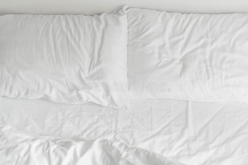 Rumpled Bed with White Messy Pillow Decoration in Bedroom Stock Photo ...
