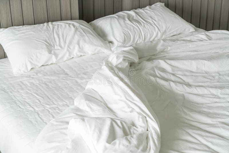 Rumpled Bed with White Messy Pillow Decoration in Bedroom Stock Photo ...