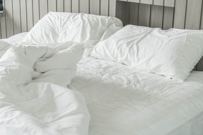 Rumpled Bed with White Messy Pillow Decoration in Bedroom Stock Photo ...