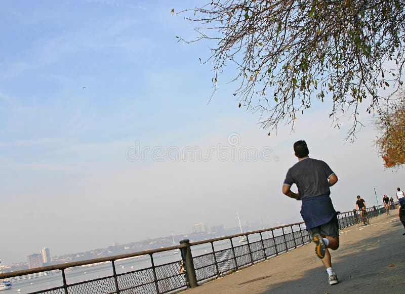 Run along a river stock image. Image of park, fall, boardwalk - 473953