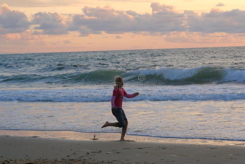 Run on the beach stock image. Image of girls, ocean, looking - 5815265