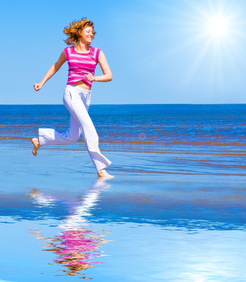 Woman running on a beach stock image. Image of shoes, alone - 6348867