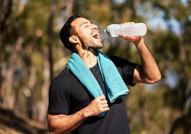 That Run Was Amazing. Shot of a Man Drinking Water while Out of a Run ...