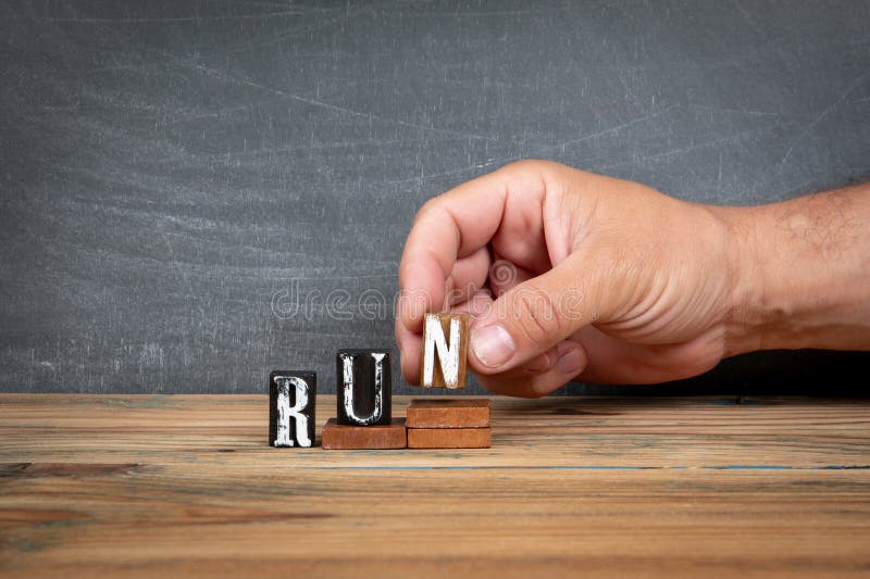 RUN. Wooden Letters, Alphabet Blocks on Steps Stock Image - Image of ...