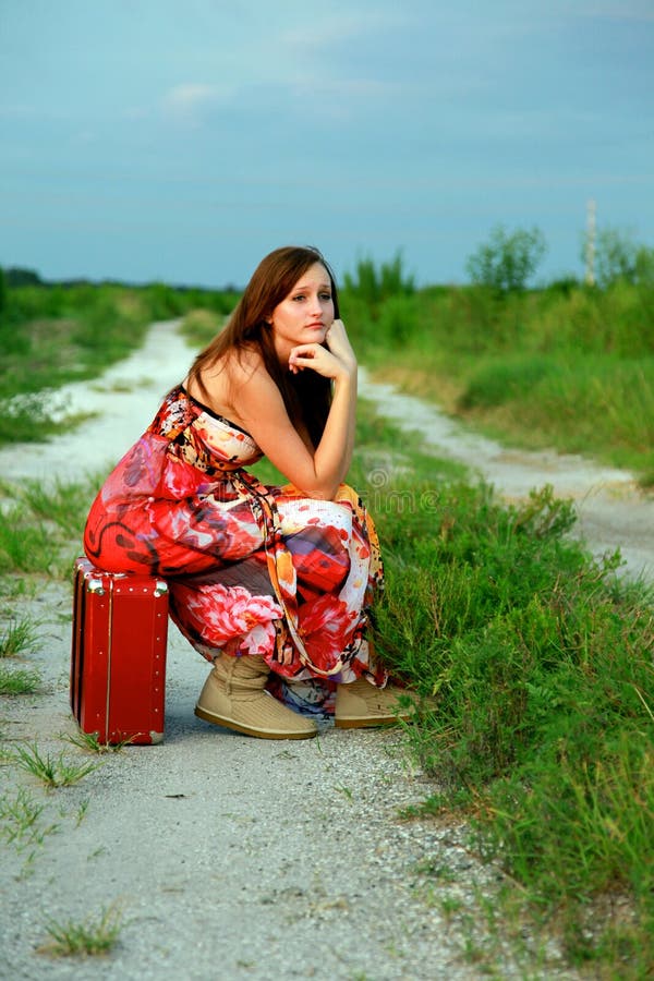 Runaway girl on suitcase stock image. Image of fearful - 10160399
