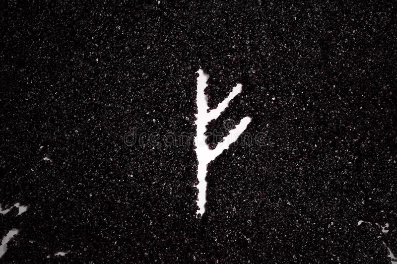 Rune Fehu Carved From Wood On A Wooden Background Stock Photo - Image ...