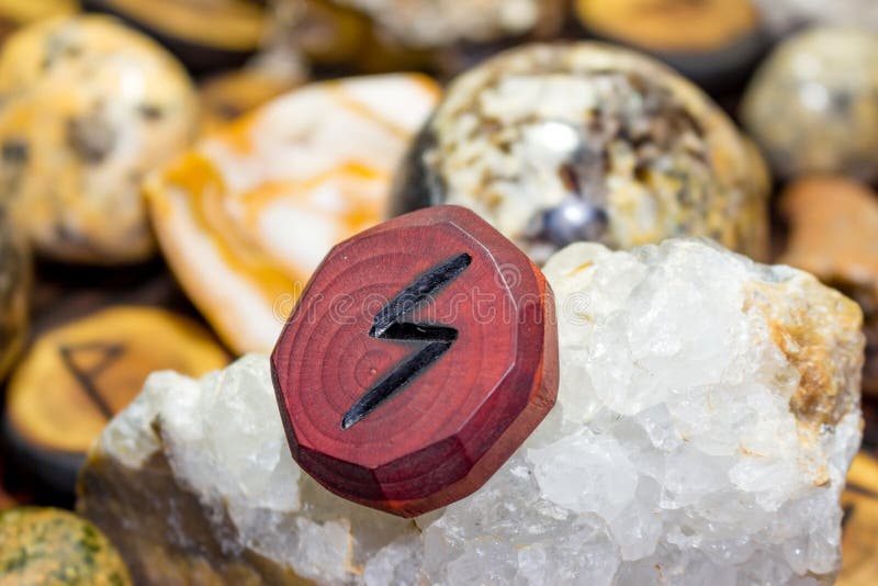 Rune Sowilo Sigel, Sol Carved from Wood on a Wooden Background Stock ...