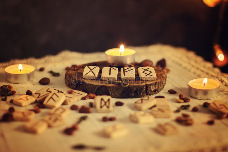 Runic Symbols on a Wooden Stand with Candles Stock Image - Image of ...
