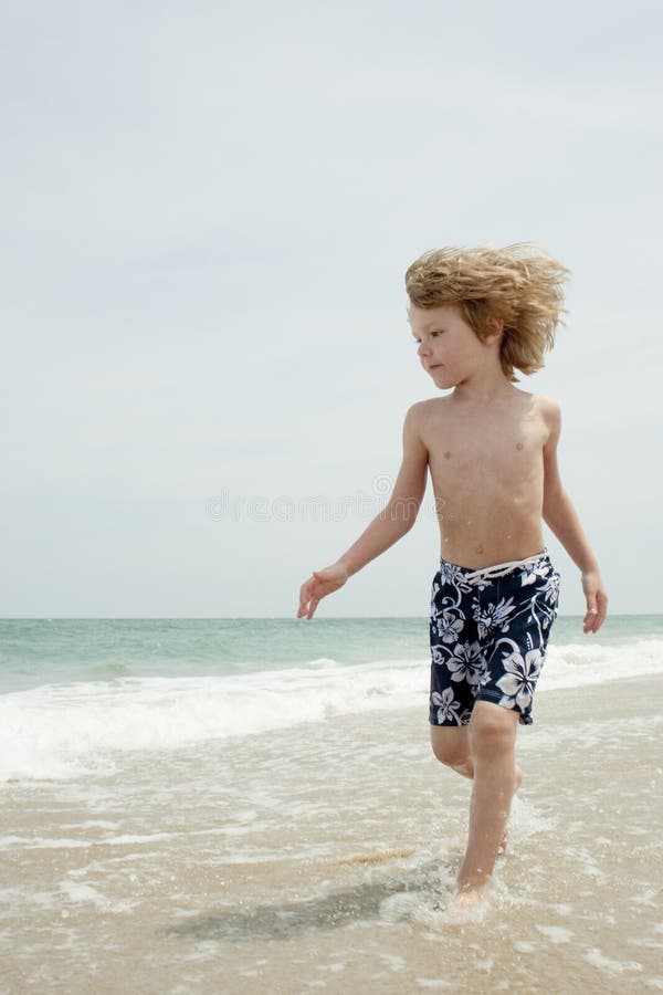 Runing along the water stock photo. Image of play, sand - 9423354