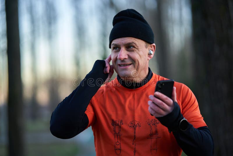 Runner Answering a Call while Running Stock Image - Image of jogger ...
