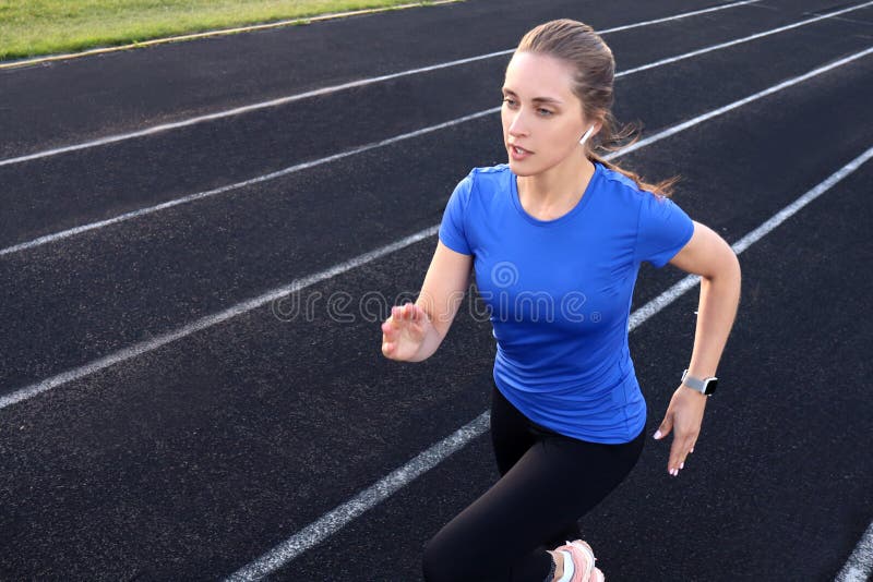 Runner Athlete Running on Athletic Track Training Her Cardio in Stadium ...