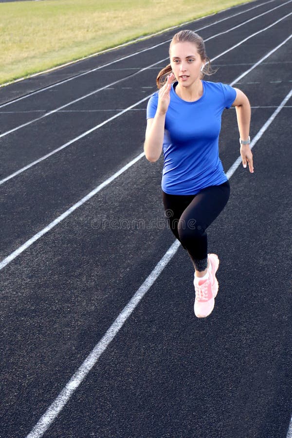 Runner Athlete Running on Athletic Track Training Her Cardio in Stadium ...