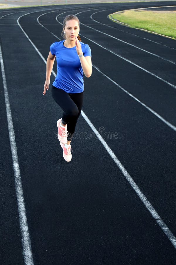 Runner Athlete Running on Athletic Track Training Her Cardio in Stadium ...