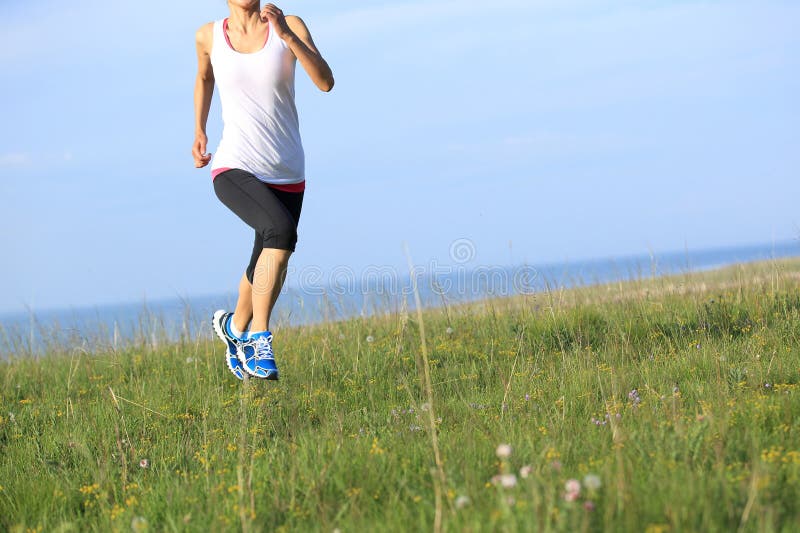 Runner Athlete Running on Grass Seaside. Stock Photo - Image of field ...