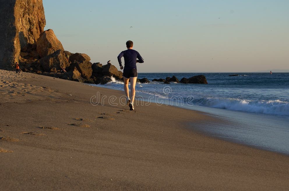 Runner on Beach Shore stock image. Image of footprints - 494123
