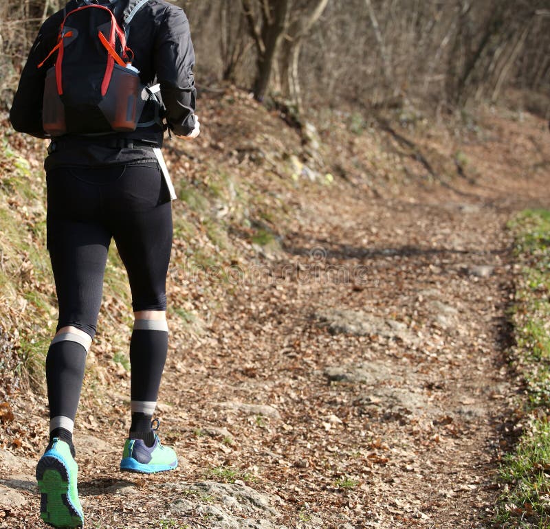 Runner from Behind during Racing on the Mountain Trail in Winter Stock ...