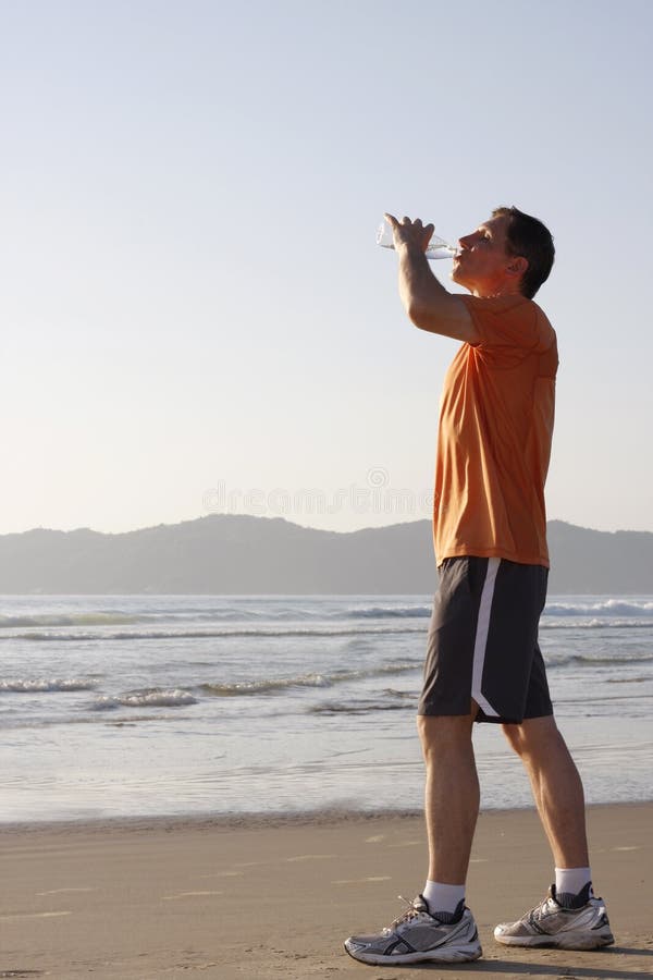 Runner drinking water stock photo. Image of coast, sport - 12876494