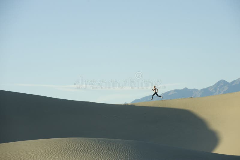 Runner on Sand Dunes stock photo. Image of blonde, body - 13881708