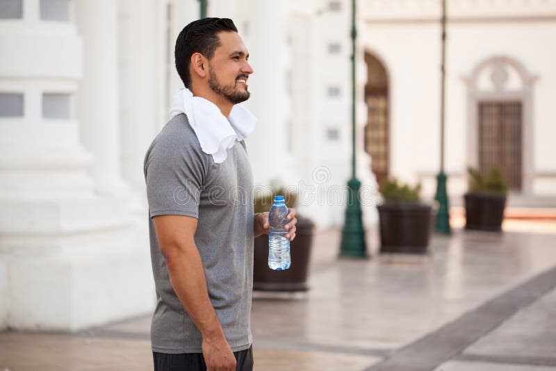 Runner Exercising and Taking a Water Break Stock Photo - Image of ...