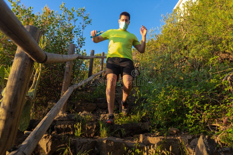 Runner with Face Mask Down a Path. Stock Image - Image of flask ...