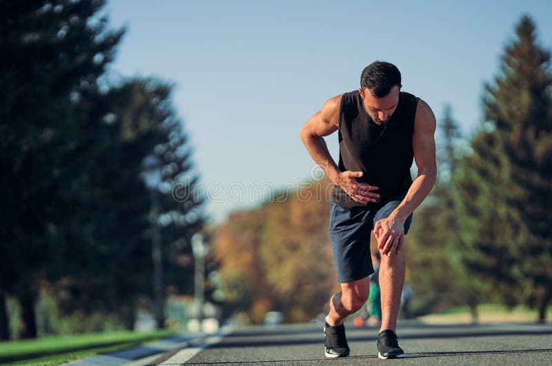 The Runner Feeling Bad while Running. Stock Photo - Image of park ...