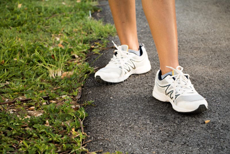 Runner Feet Running on Road Closeup on Shoe. Stock Image - Image of ...