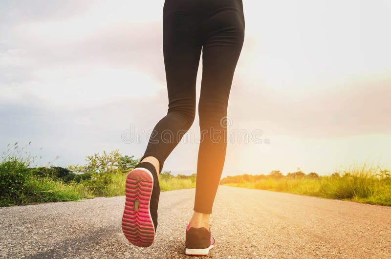 Runner Feet Running on Road Closeup on Shoe and Sunlight Stock Photo ...