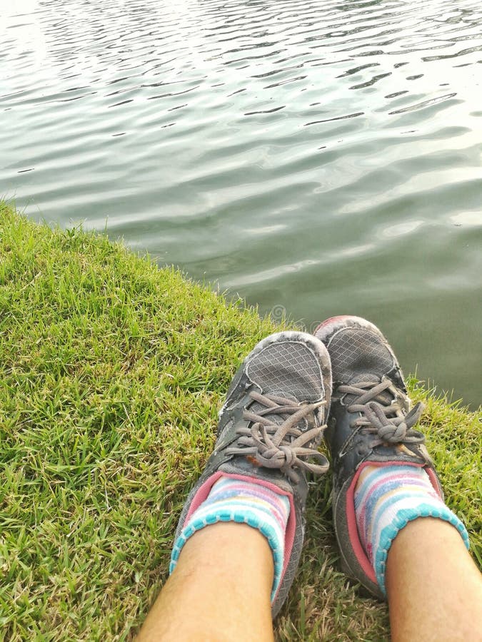 Runner Girl and Running Shoes Selfie with Green Grass. Stock Image ...