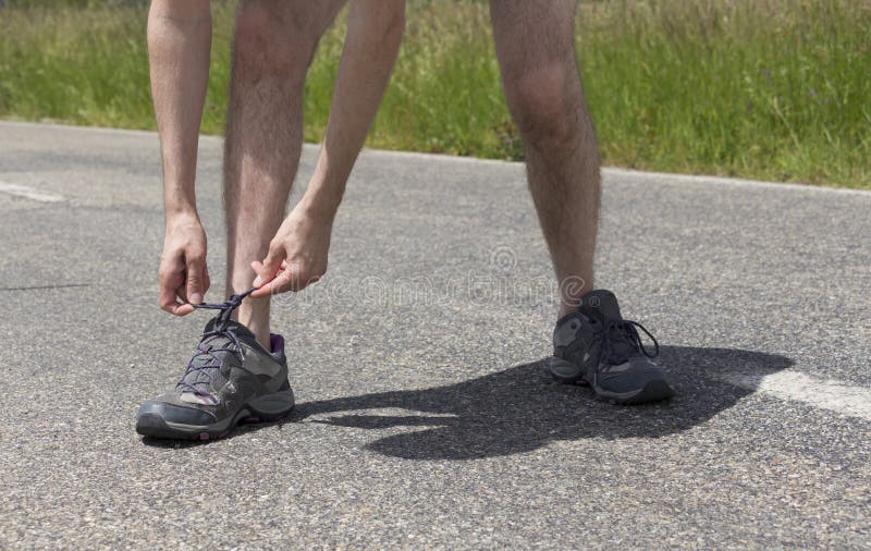 Runner Man Binding the Shoe Laces Stock Image - Image of string, road ...