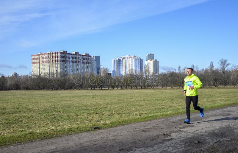 Runner Running on Road during Marathon Run Doing High Intensity ...