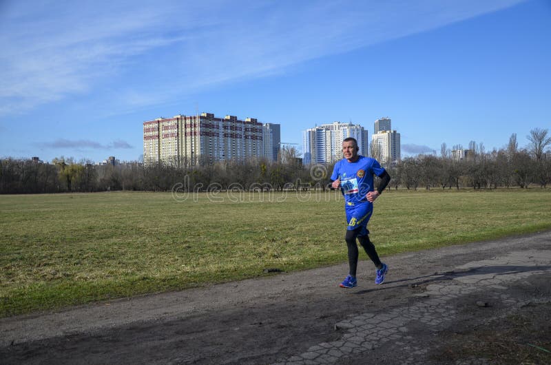 Runner Running on Road during Marathon Run Doing High Intensity ...