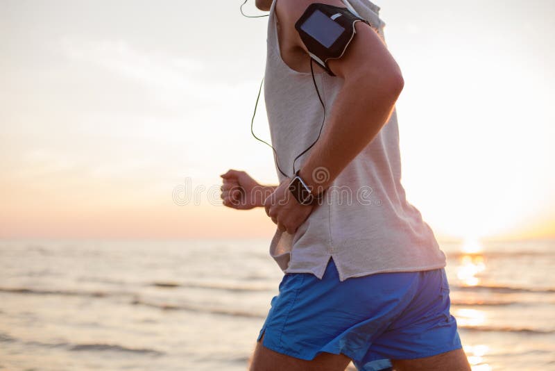 Runner with Music Player and Smartwatch on His Wrist Stock Photo ...