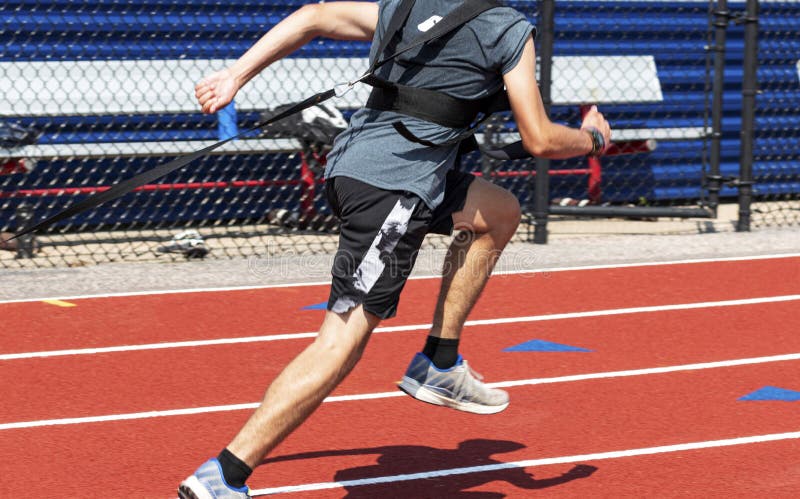 Runner Sprinting While Pulling A Sled With Weights Stock Photo - Image ...