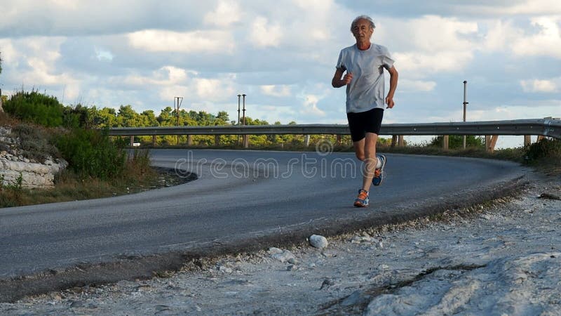 Runner Running Curved Road Morning Stock Footage - Video of marathon ...