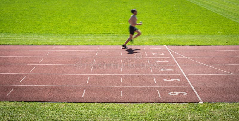 Runner on a Running Track Finishing a Race First Stock Photo - Image of ...