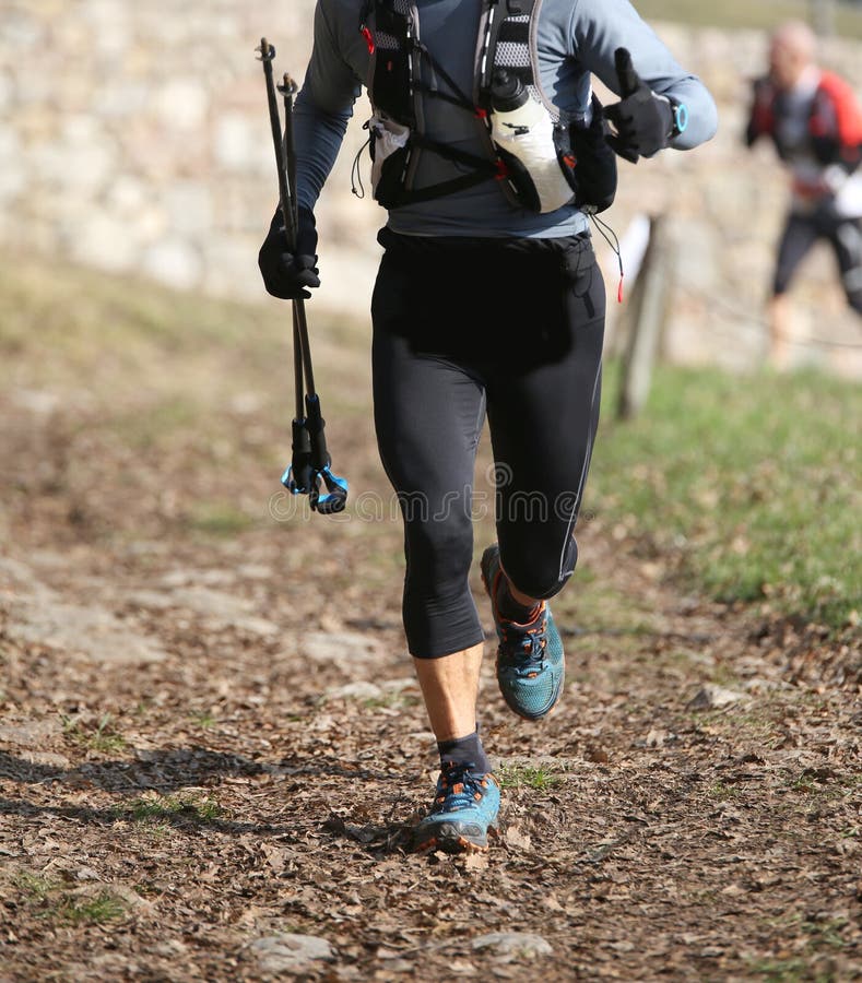 Runner Runs in the Mountains with Nordic Walking Sticks Stock Image ...