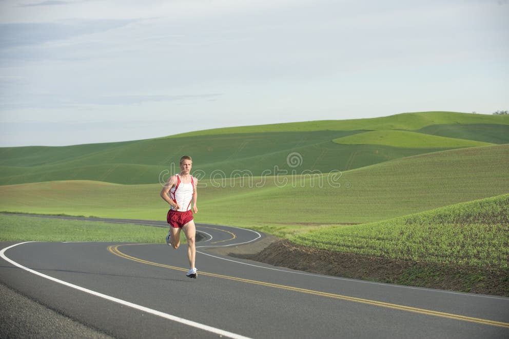 Runner on Rural Road stock photo. Image of runner, landscape - 9833204