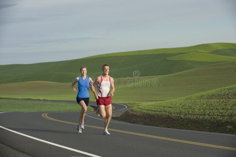 Runners running on road stock image. Image of outside - 19531461