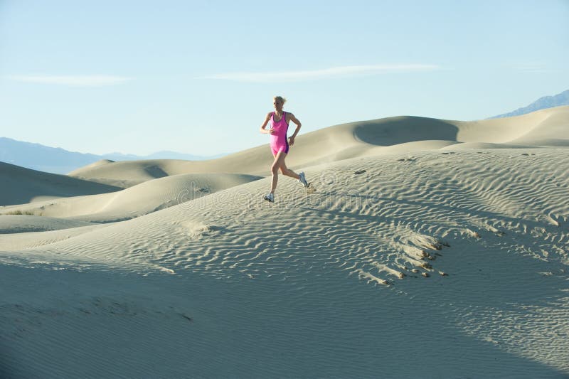 Runner on Sand Dunes stock photo. Image of blonde, body - 13881708