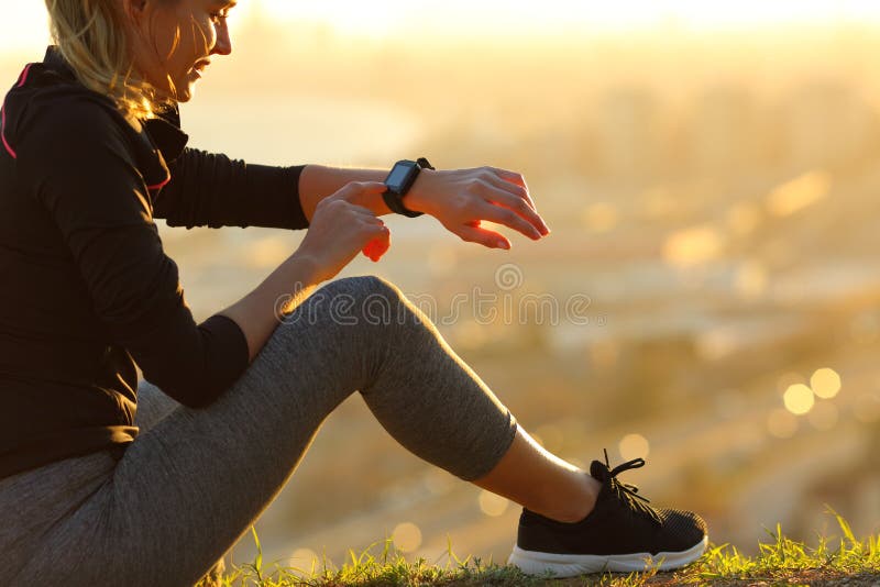 Runner Sitting Checking Smartwatch after Running Stock Image - Image of ...
