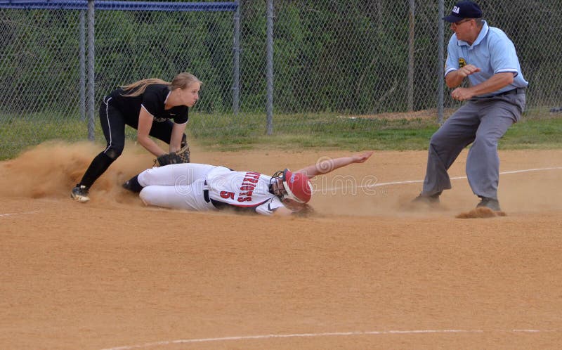 Runner Slides into a Base in a Softball Game Editorial Stock Image ...