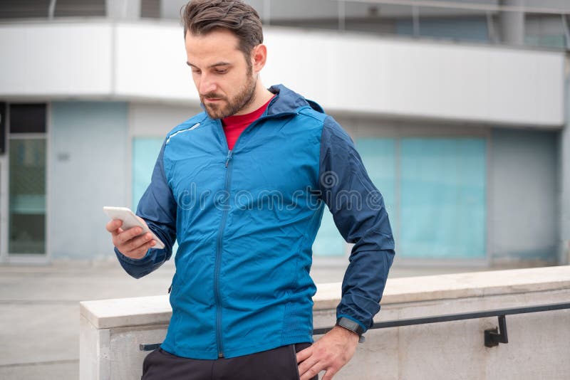 Runner Sportsman Holding Mobile Phone during Workout Stock Photo ...