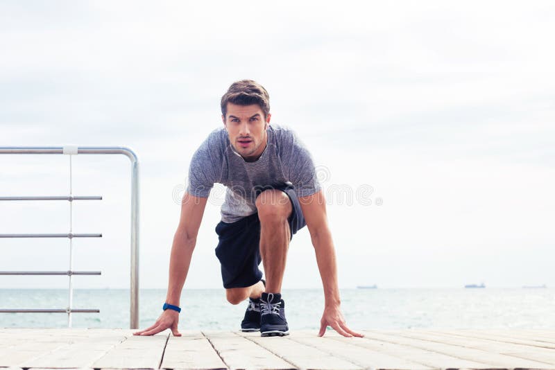 Runner Standing in Start Position Outdoors Stock Image - Image of ...