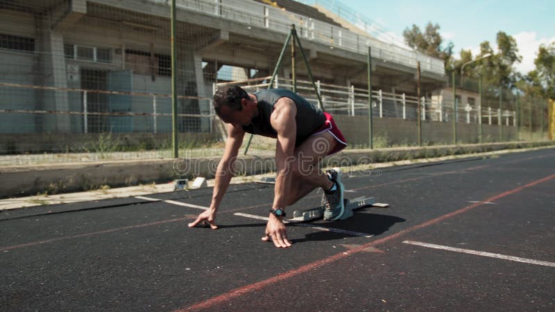 Runner on the Starting Blocks in Position Stock Footage - Video of ...