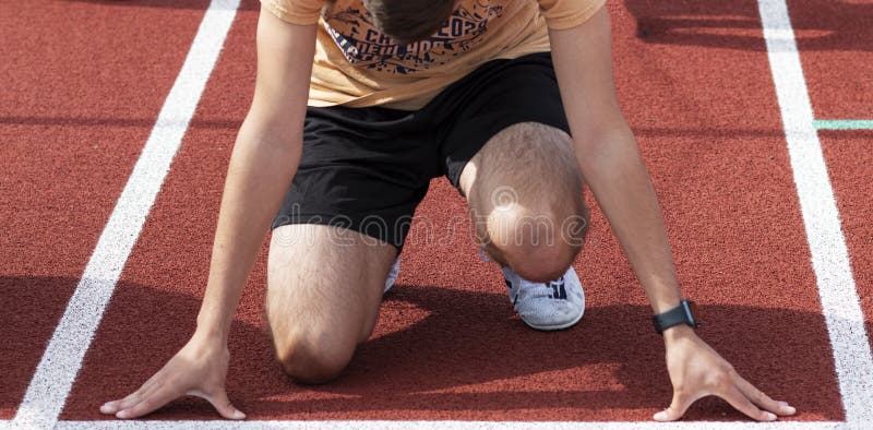 Runner at the Starting Line in the on Your Mark Position Close Up Stock ...