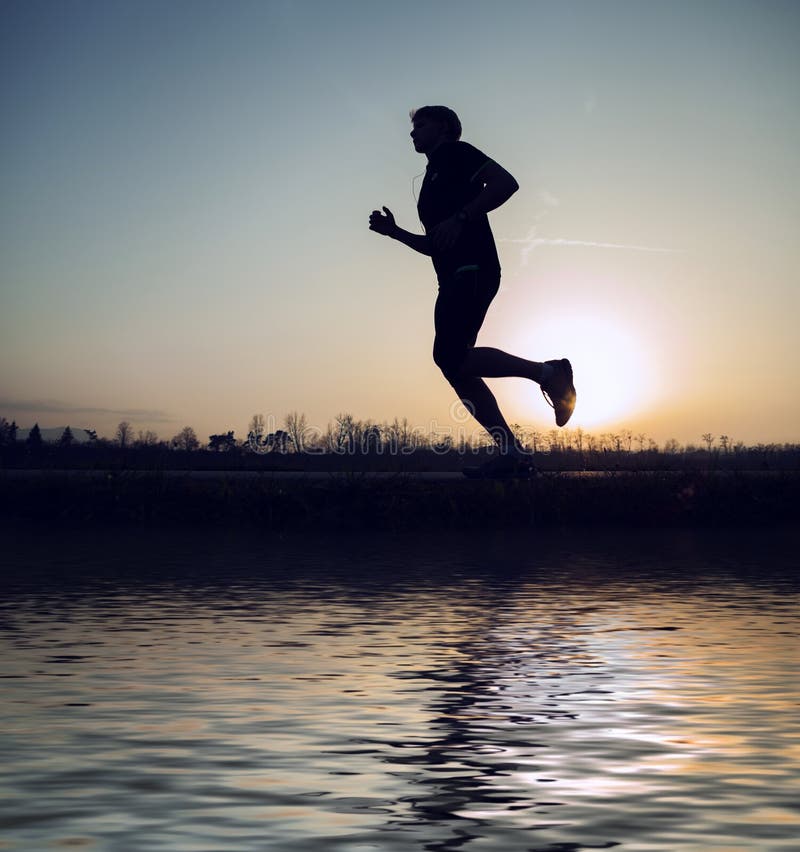 Runner Sunset Silhouette with Mirror in Water Stock Image - Image of ...