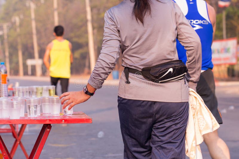 Runner Take a Water in a Marathon Race Editorial Stock Image - Image of ...