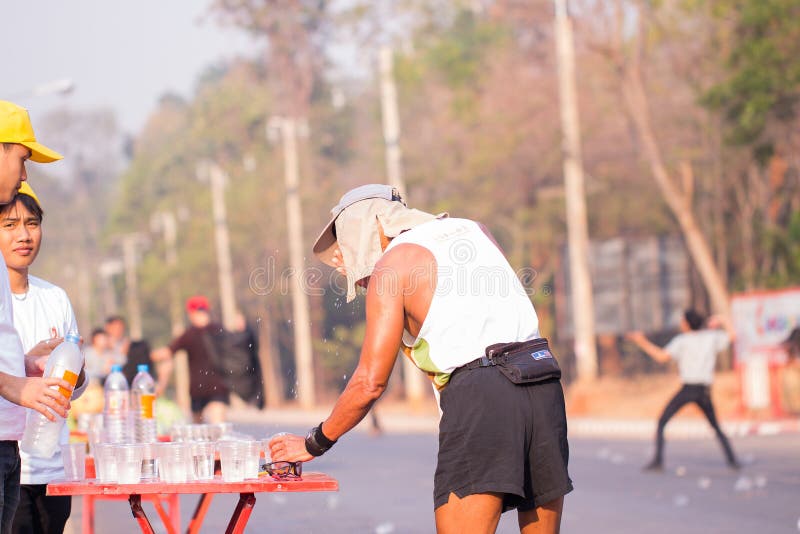 Runner Take a Water in a Marathon Race Editorial Stock Image - Image of ...