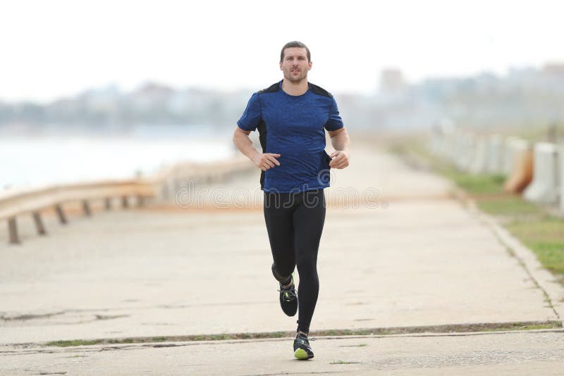 Runner Training Running Towards Camera Stock Photo - Image of alone ...